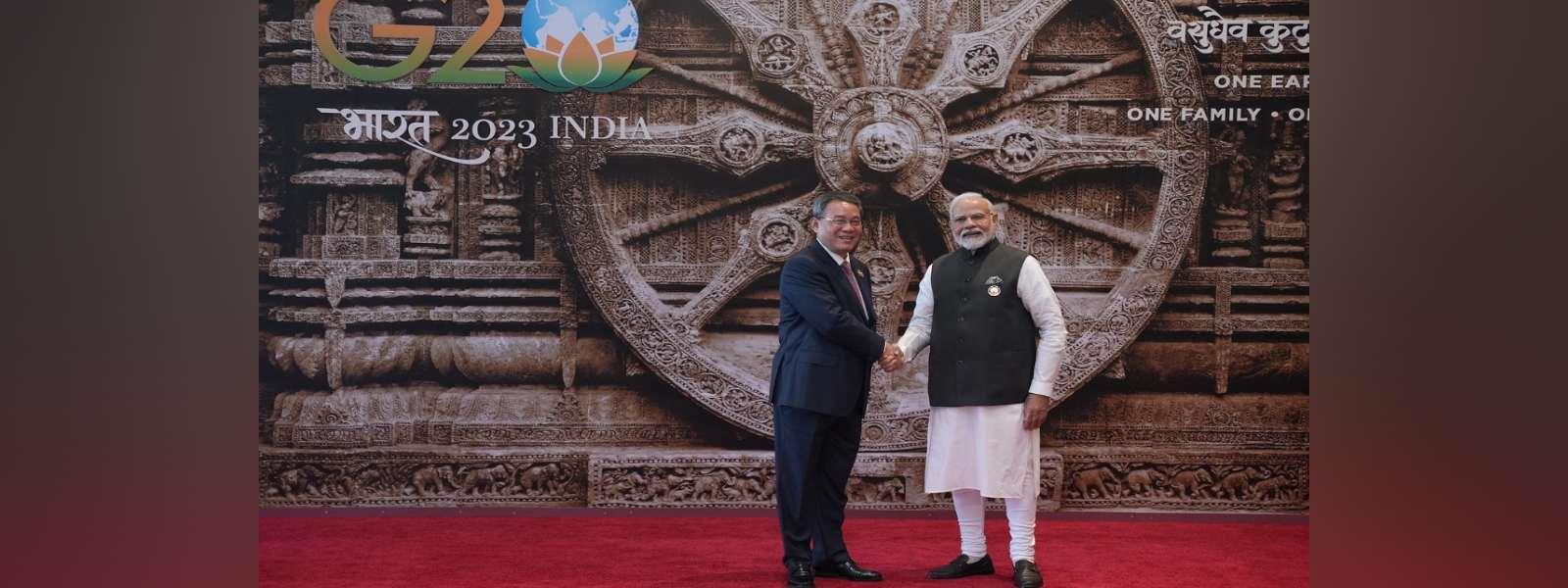 Premier of China, H.E. Mr. Li Qiang welcomed by Prime Minister Shri Narendra Modi at Bharat Mandapam